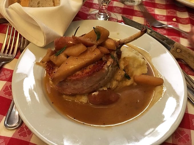 This isn't just any pork chop &ndash; it's a masterpiece with caramelized apples and a sauce so good you'll contemplate drinking it directly from the plate.