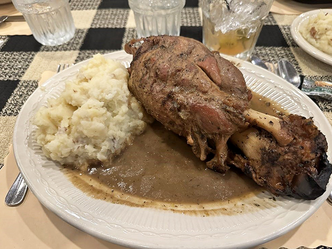 This pork shank isn't just fall-off-the-bone tender&mdash;it practically leapt off the bone to dive into that savory gravy lake. Mashed potato island included.