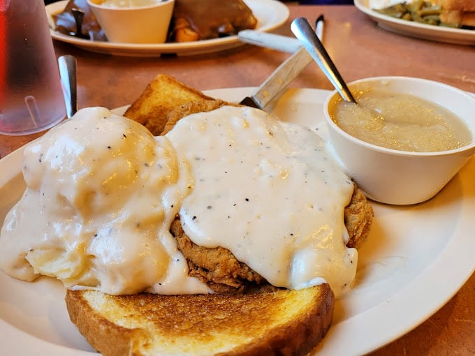 This chicken fried steak doesn't just sit on the plate&mdash;it commands it, smothered in gravy that's practically asking for a biscuit to mop it up.