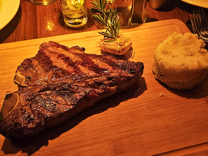 This porterhouse steak on a wooden board looks like it could solve world peace, one bite at a time.