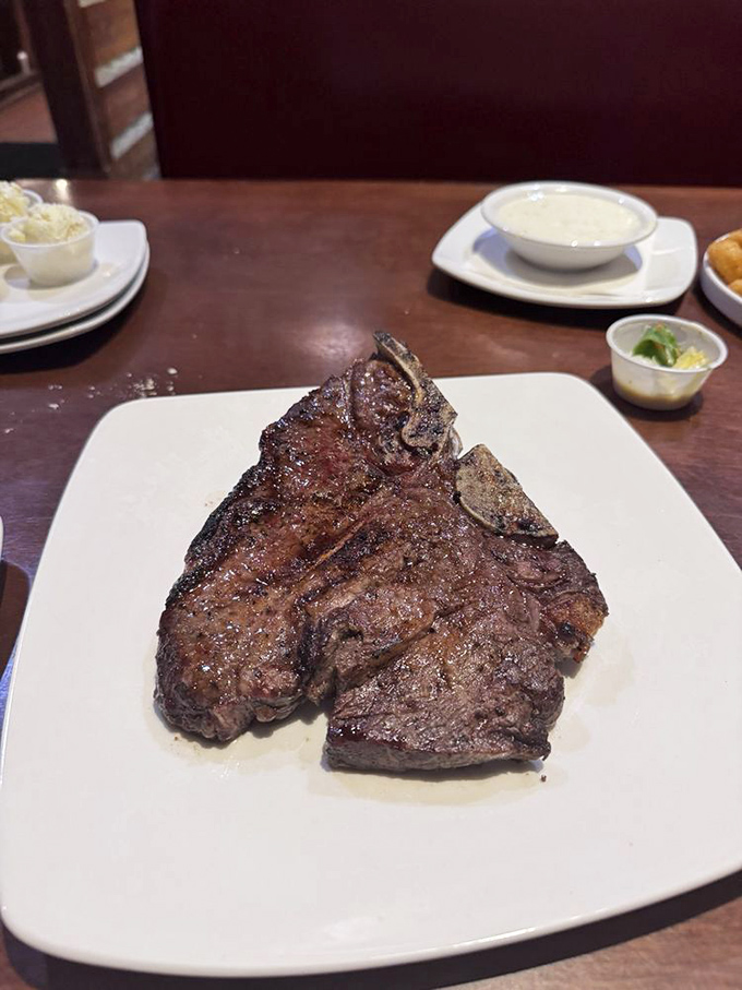 A porterhouse steak that commands respect and its own zip code. This isn't dinner; it's a carnivorous celebration on a plate.