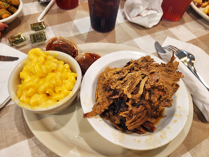 Pulled pork that doesn't need teeth to enjoy&mdash;it practically melts on contact. Paired with mac and cheese that glows like Florida sunshine.