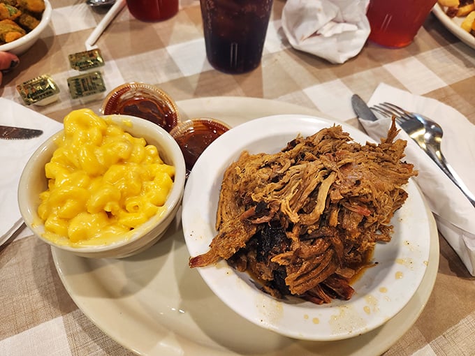 Pulled pork that doesn't need teeth to enjoy&mdash;it practically melts on contact. Paired with mac and cheese that glows like Florida sunshine.