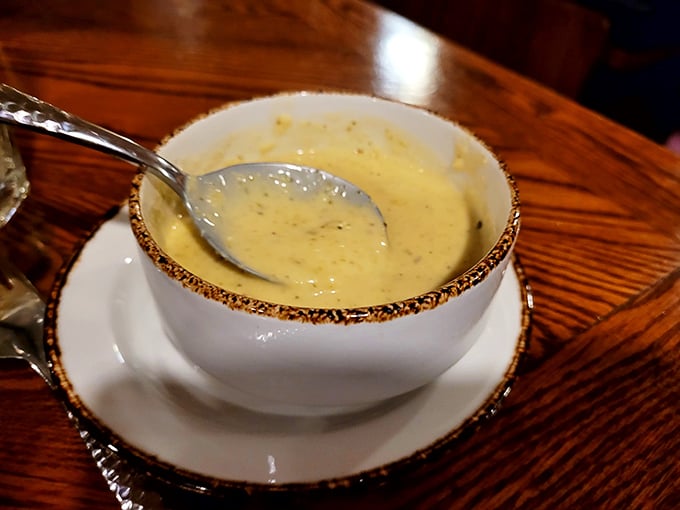 A bowl of creamy potato soup that looks like liquid comfort. The kind of starter that makes you wonder if you should just order three more bowls and call it dinner.