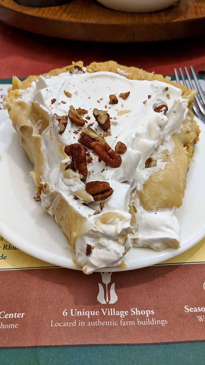 This isn't just pie&mdash;it's a towering monument to the art of dessert-making, with pecans standing guard over layers of creamy perfection.