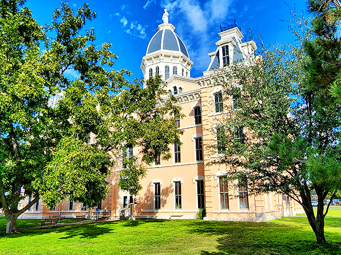 The Presidio County Courthouse stands majestic against the Texas sky, its dome a beacon of Victorian splendor.