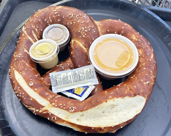Not your ballpark pretzel! This magnificent German-style beauty comes complete with dipping sauces that elevate the humble pretzel to art form status.