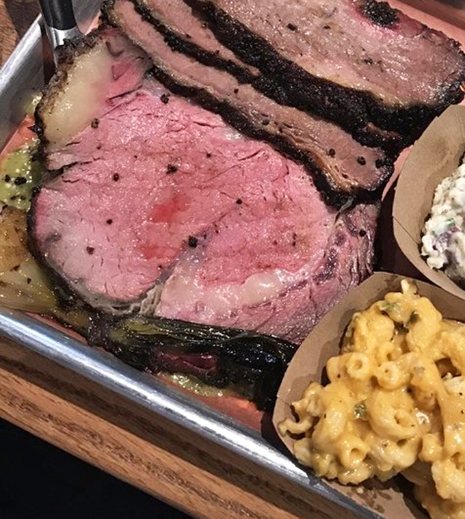 Prime beef that's been kissed by smoke and time. The pink interior and blackened crust create a flavor symphony worth driving hours for.