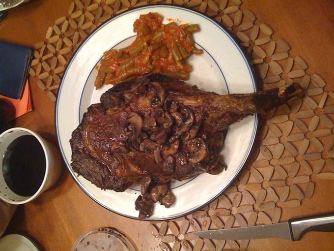 That ribeye isn't just dinner&mdash;it's wearing a crown of saut&eacute;ed mushrooms like it knows exactly how royal it truly is.