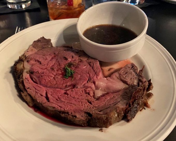 Prime rib so perfectly pink it should come with its own Instagram filter, accompanied by au jus that's practically liquid gold.