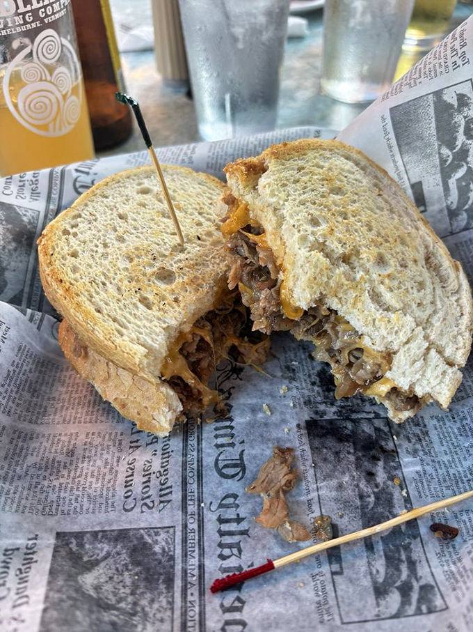 This sandwich isn't messing around&mdash;tender prime rib nestled between toasty bread with melty cheese that's having the time of its life. Half-eaten because nobody has that much willpower.