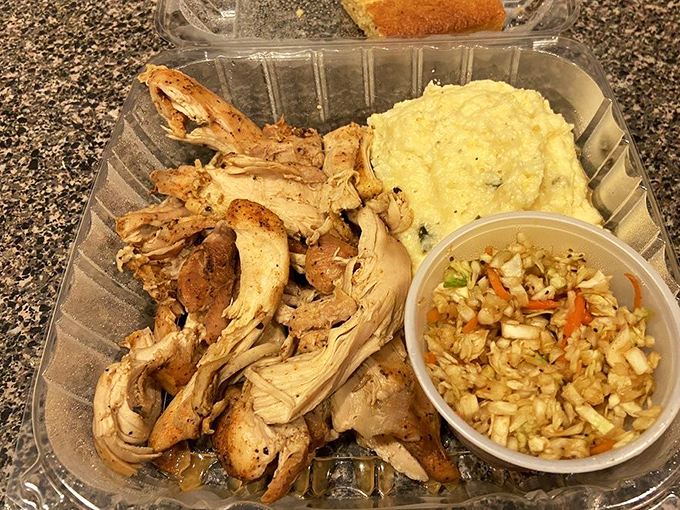 Pulled chicken that actually deserves your attention at a barbecue joint &ndash; tender, smoky, and ready to make you question your usual pork allegiance.