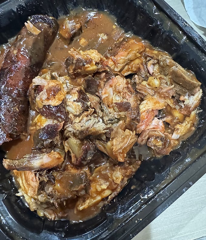 Pulled pork so tender it surrenders at the mere suggestion of a fork, swimming in a sauce that should be bottled and treasured.