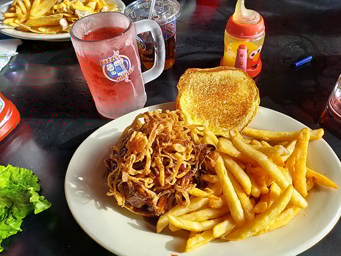 Pulled pork piled high with crispy fries on the side&mdash;this isn't just a sandwich, it's what happiness would look like if it took physical form.