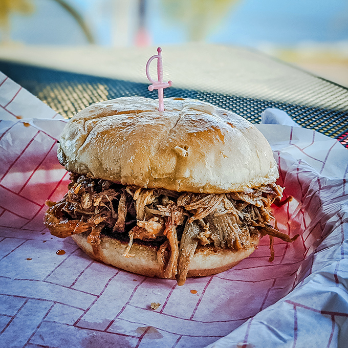 This pulled pork sandwich isn't just a meal, it's an engineering marvel—how they fit that mountain of meat between two buns defies physics.