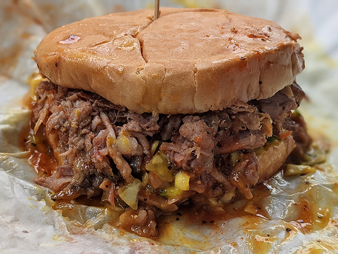 The pulled pork sandwich in its natural habitat&mdash;gloriously messy, unapologetically delicious, and worth every napkin you'll sacrifice to the barbecue gods.
