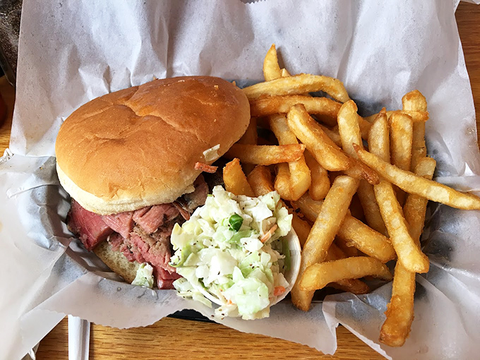 The pulled pork sandwich&mdash;where smoke-kissed meat meets pillowy bun in perfect harmony. Those fries aren't just sides; they're essential companions.