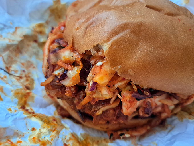 The pulled pork sandwich that launched a thousand road trips. That kimchi slaw adds a tangy crunch that'll haunt your dreams.