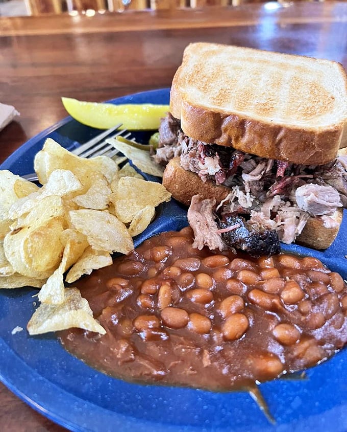 Pulled pork that looks like it's posing for its glamour shot. Tender strands of smoky goodness nestled between Texas toast with perfect sidekicks.