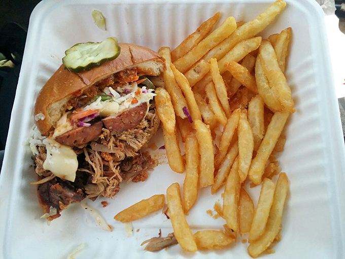 The pulled pork sandwich&mdash;where smoke meets soul. Those fries aren't just sides; they're essential supporting actors in this delicious drama.