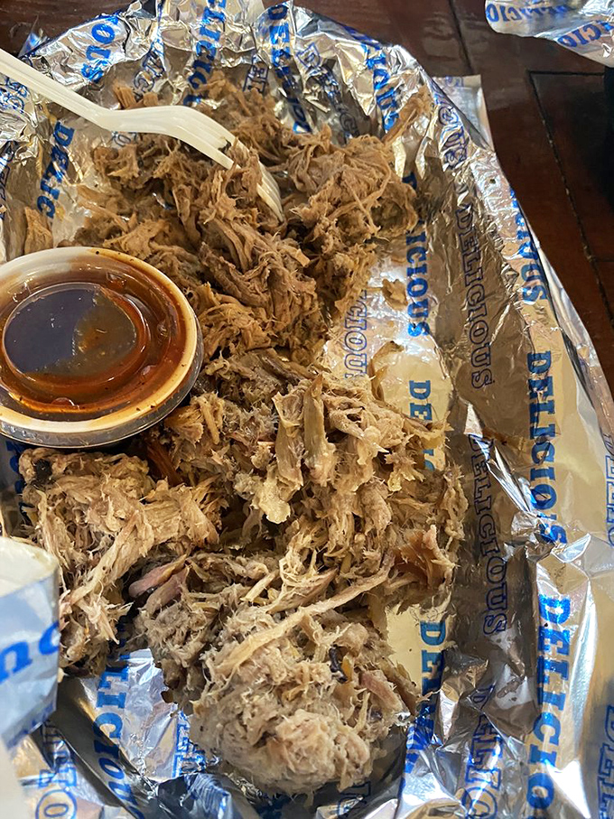Pulled pork piled high enough to require structural engineering, waiting to be devoured by someone with ambition.