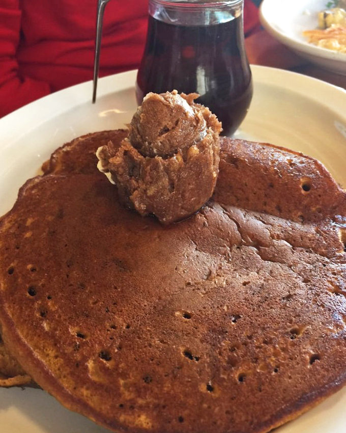 Pancakes with a scoop of cinnamon butter melting on top—proof that sometimes the simplest pleasures are the most profound.