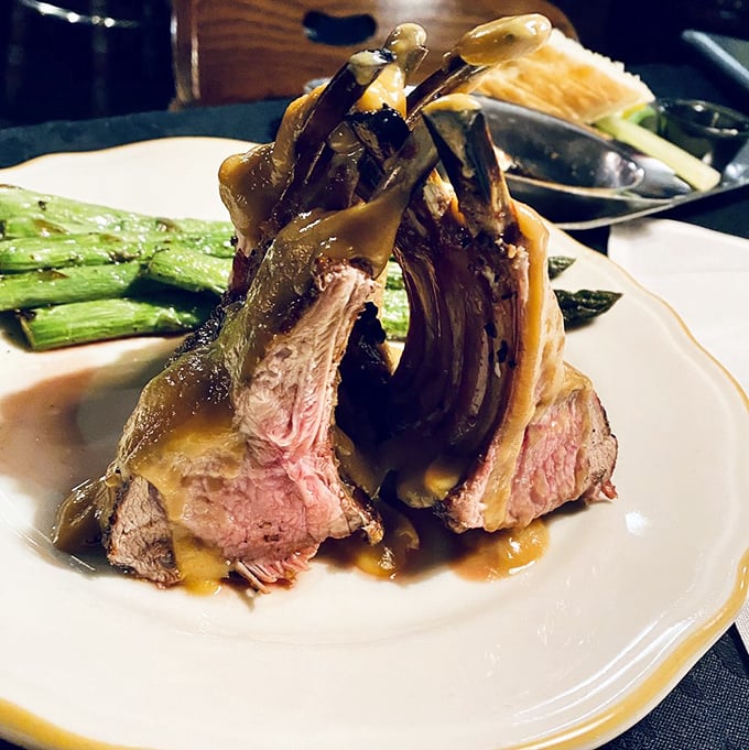 The rack of lamb stands at attention like it's auditioning for a food magazine cover shoot, with that perfect pink center stealing the show.