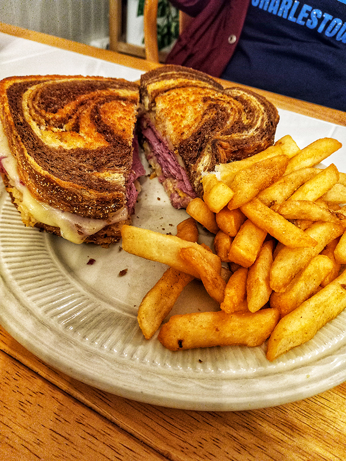 Marbled rye embraces tender corned beef in this Reuben that's grilled to perfection. Those golden fries? Just the sidekick this sandwich deserves.