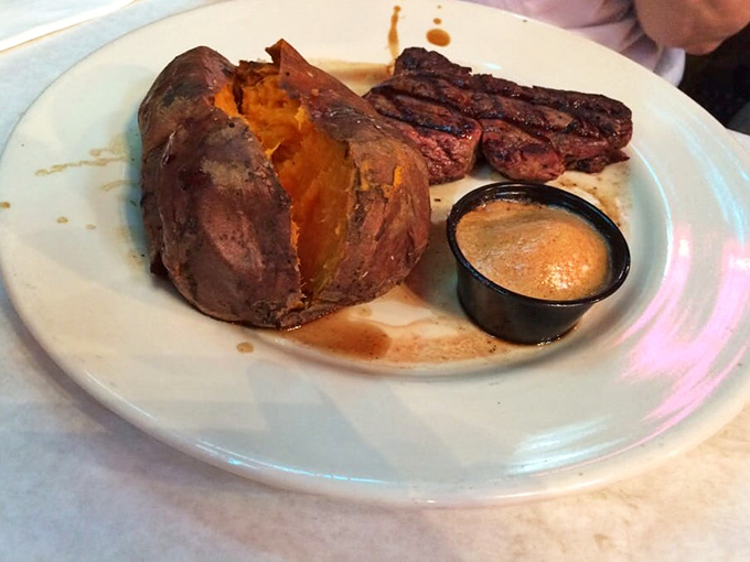 Steak and sweet potato&mdash;a romance for the ages. That sauce cup isn't just sitting there for decoration; it's waiting to elevate each bite to heavenly status.