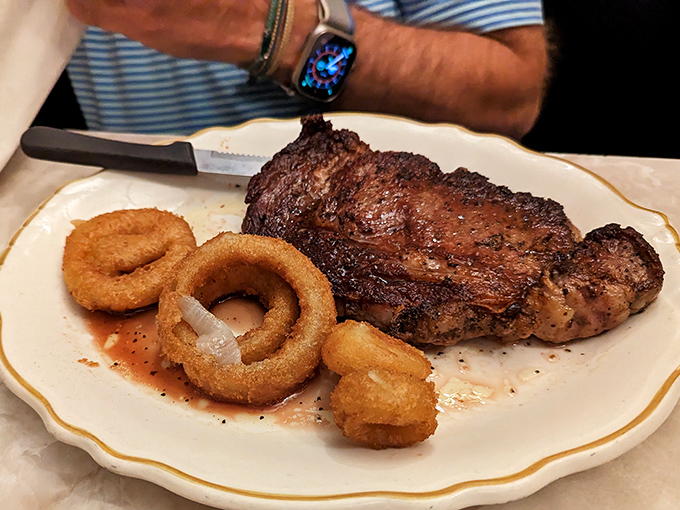 This ribeye with onion rings isn't just dinner; it's a celebration of carnivorous pleasures that would make even the most dedicated vegetarian pause for reflection.