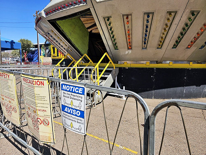 Even the rides take a break sometimes. This colorful attraction stands sentinel, temporarily closed but promising future joy to young swap meet visitors.