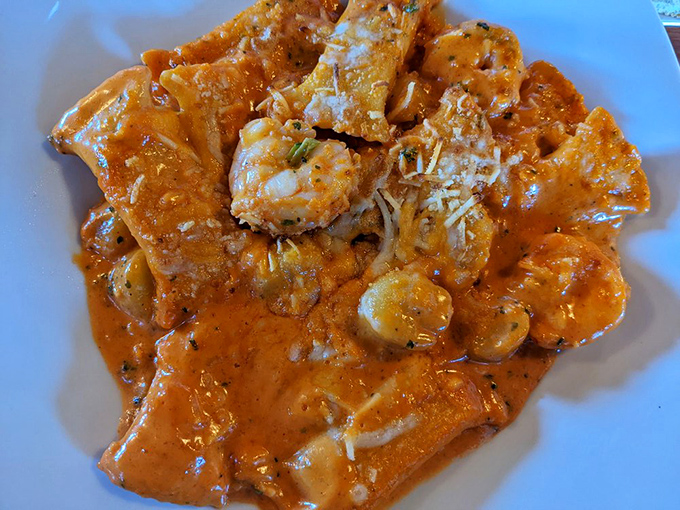 This seafood pasta isn't just a meal; it's a Mediterranean vacation for your taste buds. Note the perfect golden sear on that protein.