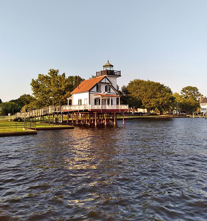 The Roanoke River Lighthouse seems to float above Edenton Bay, its weathered white clapboard and red roof a beacon to photographers and history lovers alike.