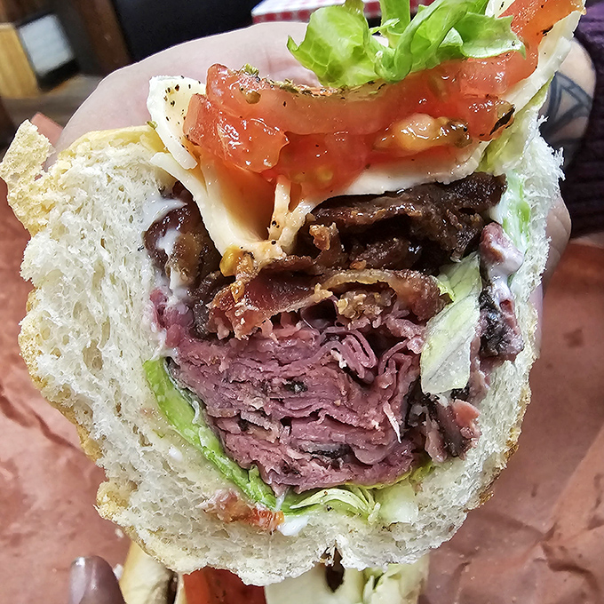 Roast beef piled high enough to require structural engineering, topped with the kind of cheese that knows its job.