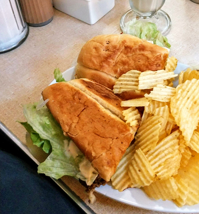 A sandwich and chips plated with the kind of straightforward honesty that would make your grandmother nod in approval.
