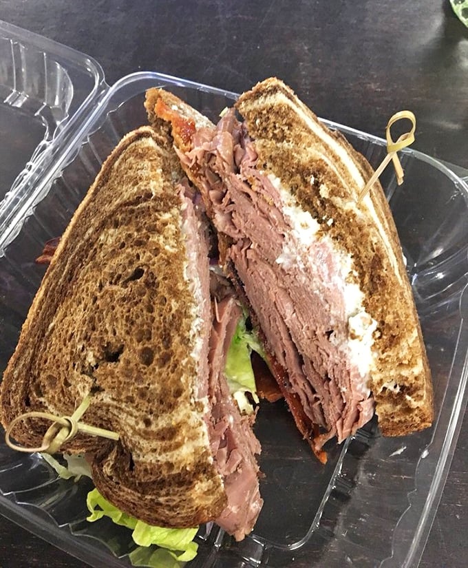 This roast beef creation isn't just a sandwich; it's architecture with flavor, each layer building toward a perfect bite.