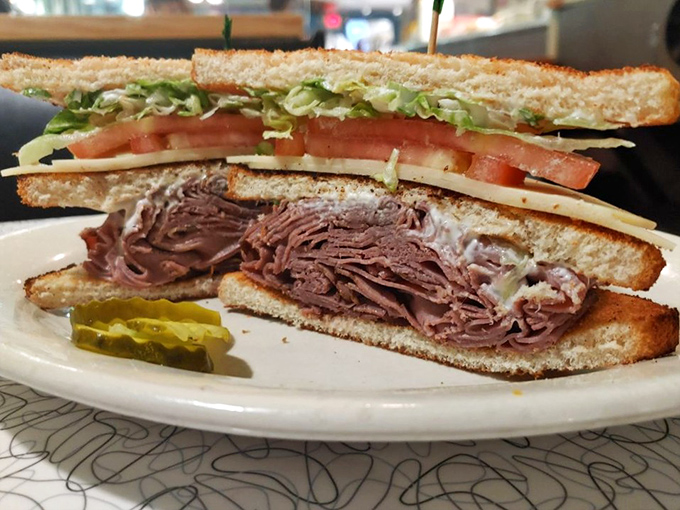 This isn't just a sandwich; it's a skyscraper of thinly-sliced roast beef with fresh veggies that requires both hands and possibly a building permit.