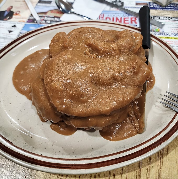 Gravy isn't just a condiment here, it's practically a food group. This hot roast beef sandwich swimming in rich brown gravy makes a compelling case for elastic waistbands.