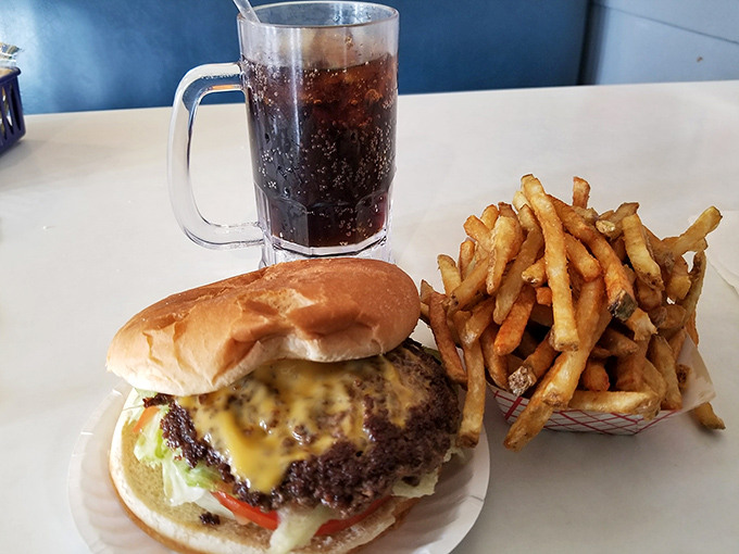 The holy trinity of diner perfection: a hand-crafted cheeseburger, golden fries, and an ice-cold root beer that makes you question why you'd eat anywhere else.