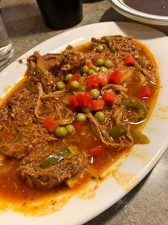 Ropa vieja translates to "old clothes" but tastes like heaven, with shredded beef so tender it surrenders to your fork.