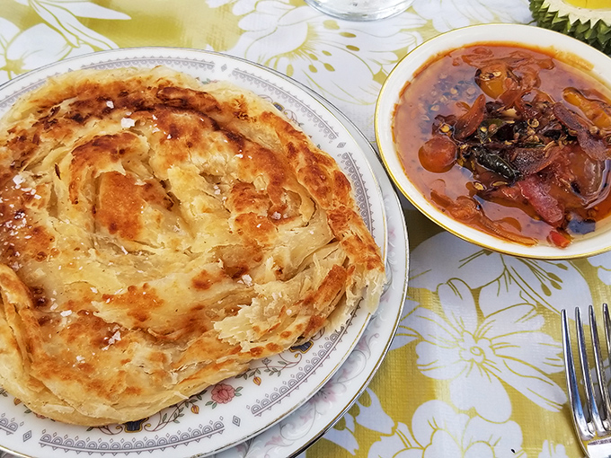 The holy grail of flatbreads&mdash;roti canai with its hypnotic spiral of flaky layers that shatter with each heavenly tear.