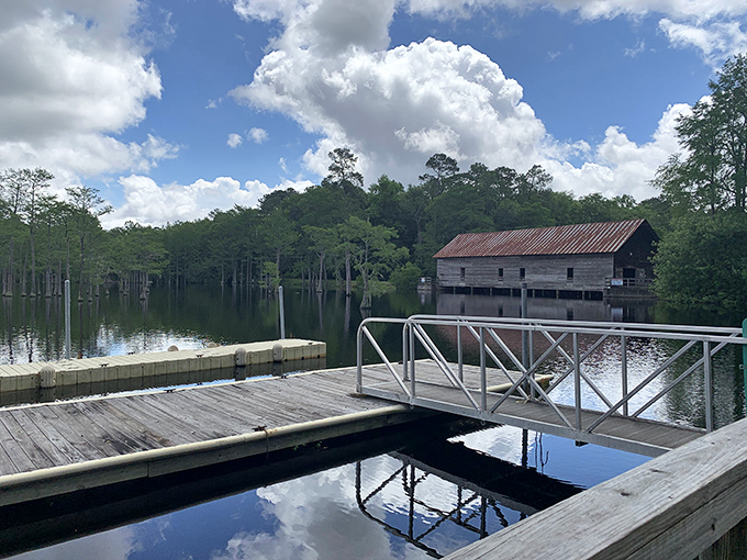Where history meets tranquility: the boat dock offers front-row seats to the weathered mill that once powered an entire community.