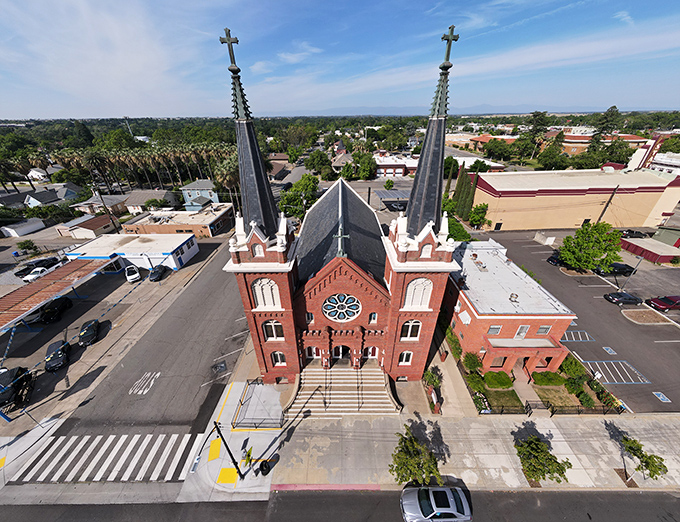 Sacred Heart Catholic Church stands as an architectural gem in Red Bluff, its twin spires reaching skyward like exclamation points punctuating the town's skyline.