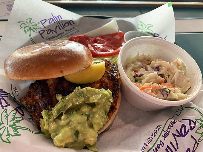 Blackened perfection meets guacamole goodness in this grouper sandwich&mdash;proof that sometimes the best beach souvenir is a flavor memory.