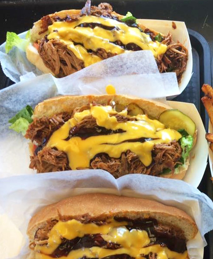 Pulled pork sandwiches dressed with cheese that don't need fancy plating &ndash; they're too busy preparing for their brief but meaningful relationship with your taste buds.