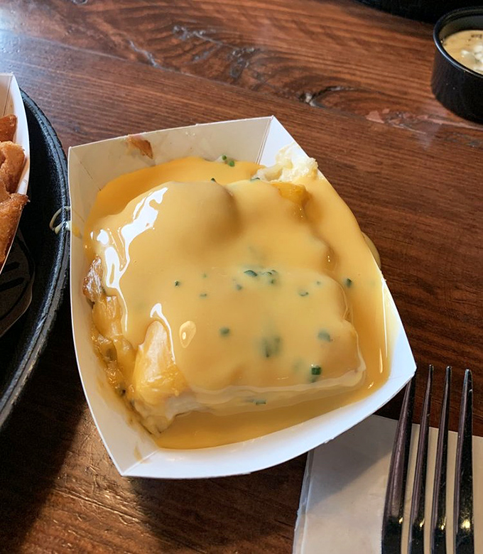 Golden scalloped potatoes drowning in cheese sauce &ndash; the side dish that threatens to steal the entire show.