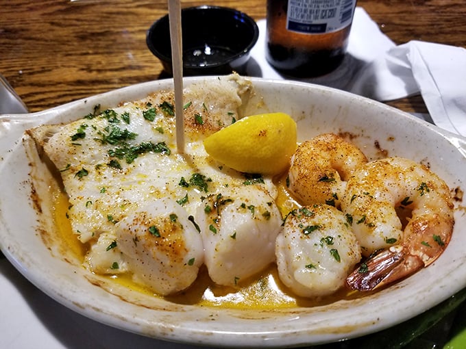 Butter-kissed scallops and shrimp sharing a plate like old friends at a reunion. That lemon wedge isn't just garnish&mdash;it's essential punctuation.