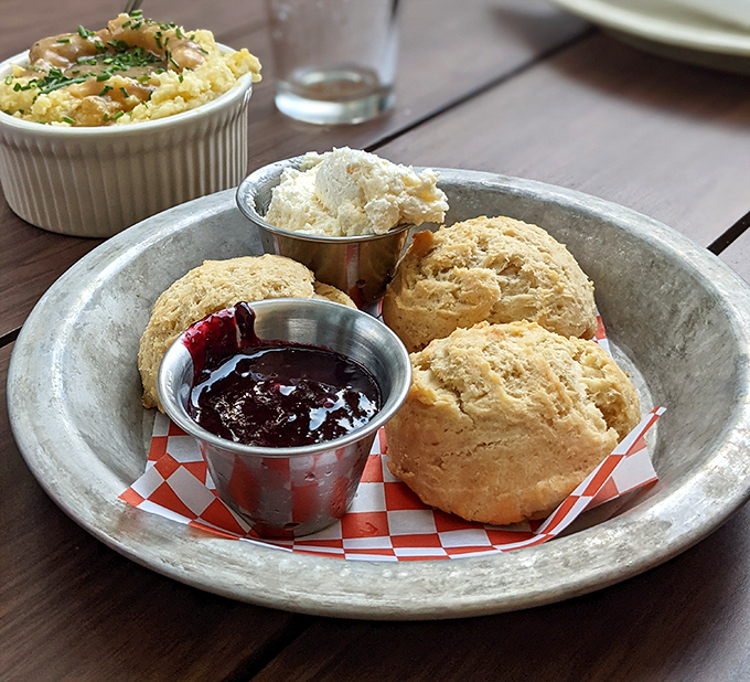 Homemade biscuits that would make your grandmother both proud and jealous, served with butter and jam for maximum comfort.