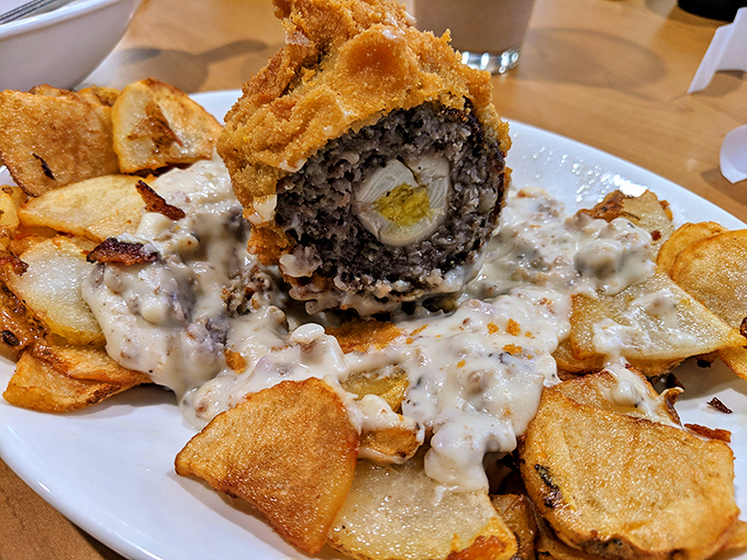 Culinary engineering at its finest &ndash; a Scotch egg nestled on homestyle potatoes with gravy that would make your grandmother both jealous and proud.