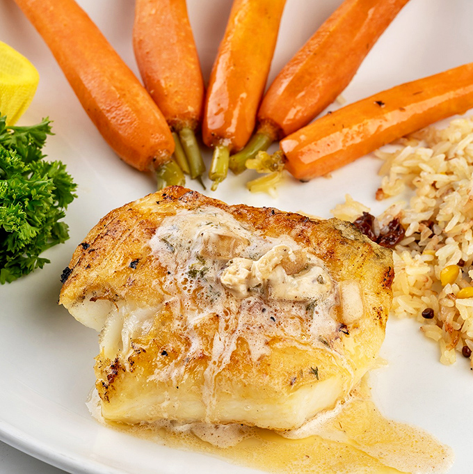 Flaky perfection with colorful companions - this sea bass knows how to make a grand entrance properly.